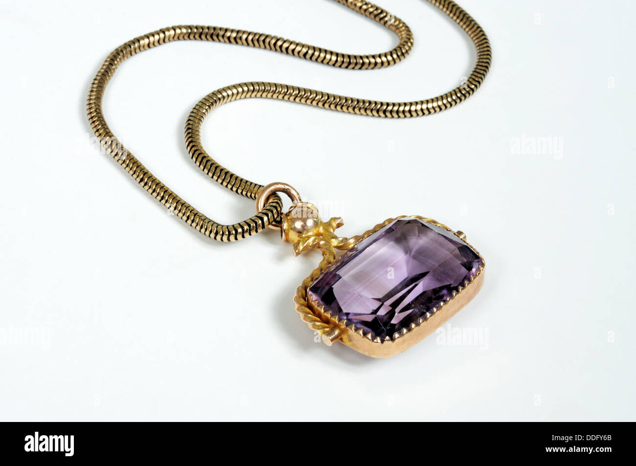 Rectangular Amethyst pendant on a snake chain against a white ...