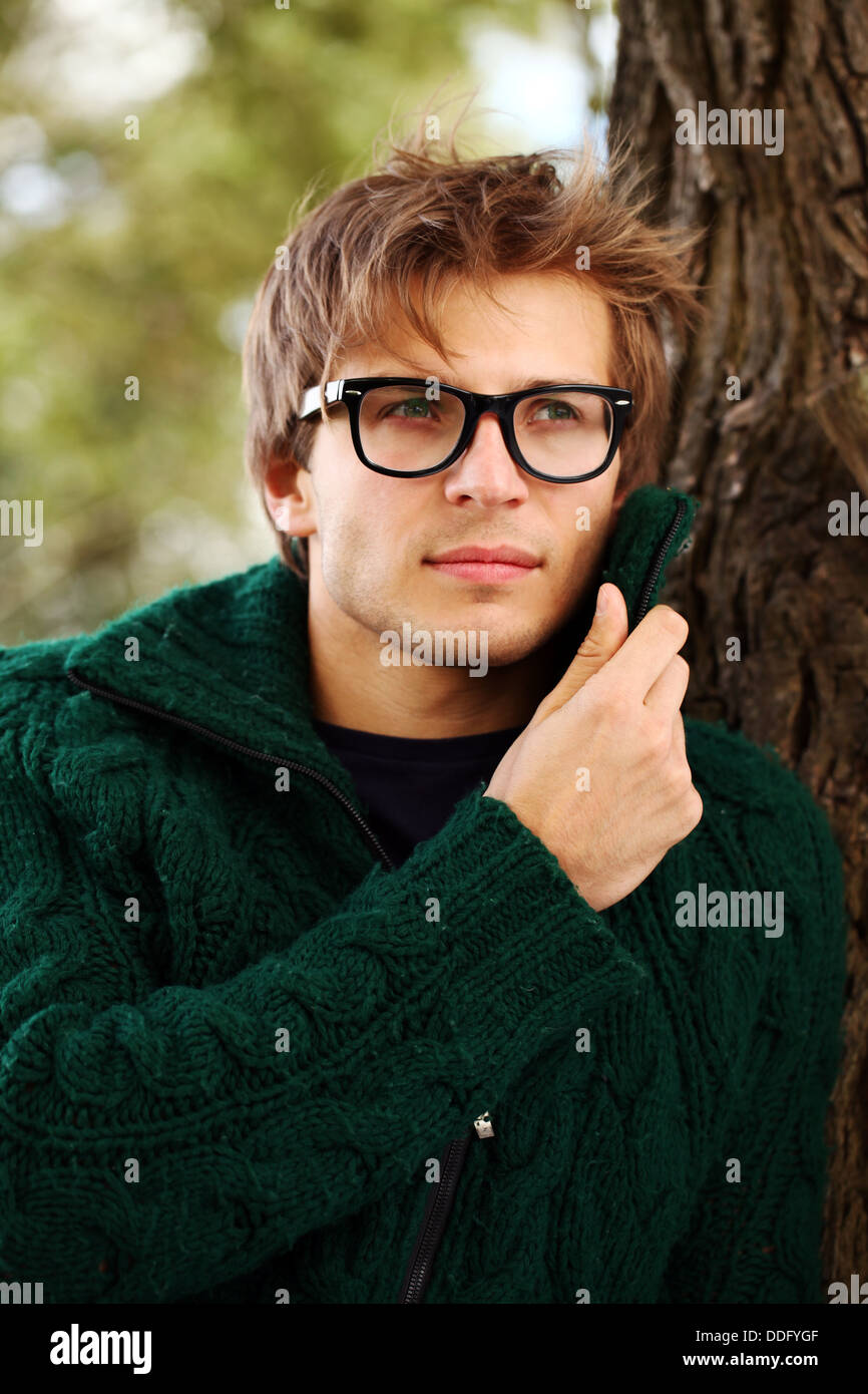 Handsome guy at cold autumn day in the park Stock Photo - Alamy