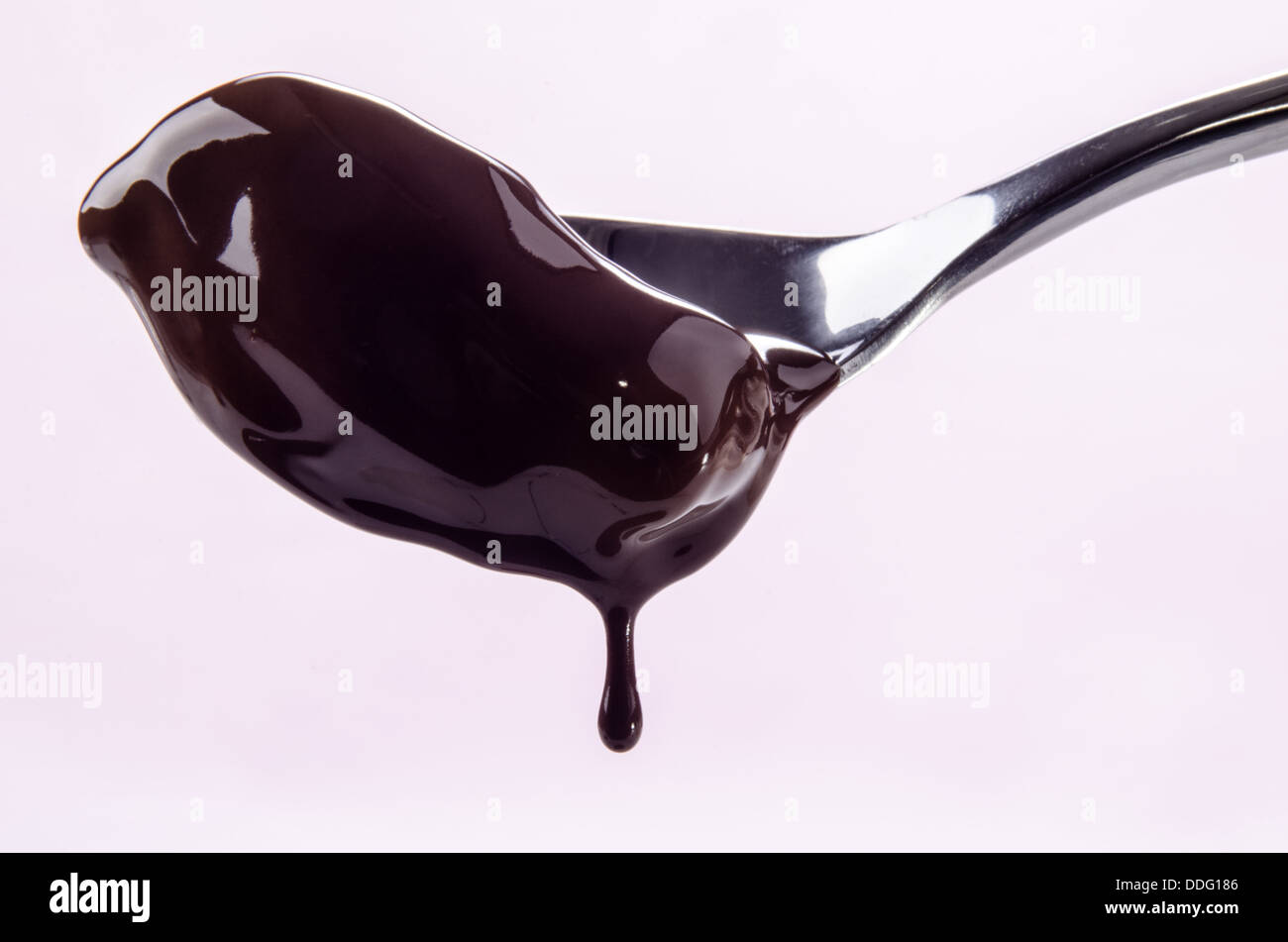 melted chocolate on a spoon Stock Photo - Alamy