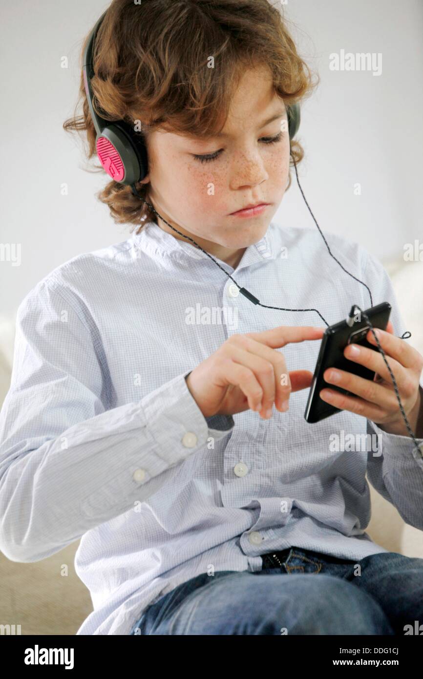 Boy using smartphone Stock Photo - Alamy