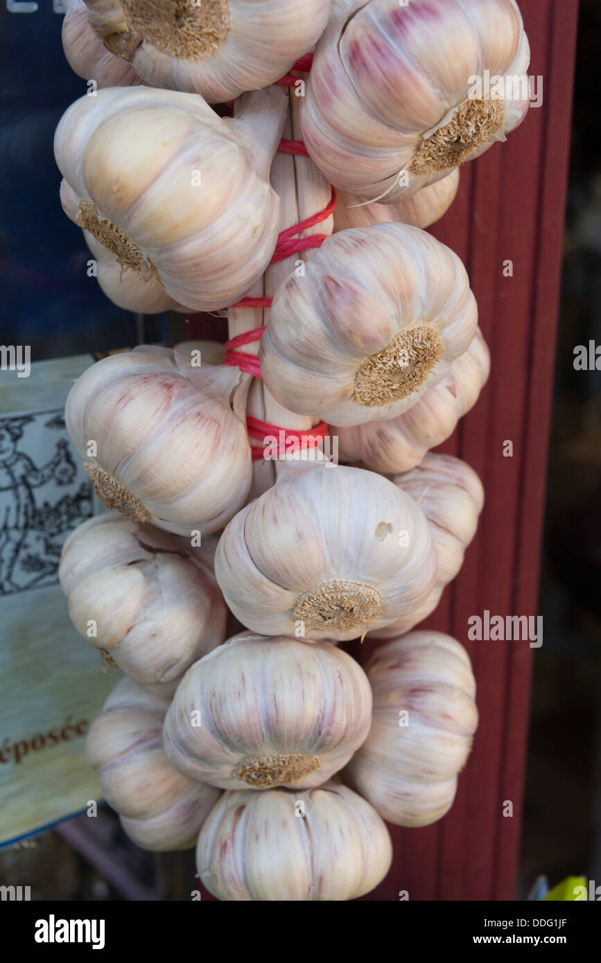 String of pink garlic on sale in medieval town of Cordes sur Ciel, Tarn ...