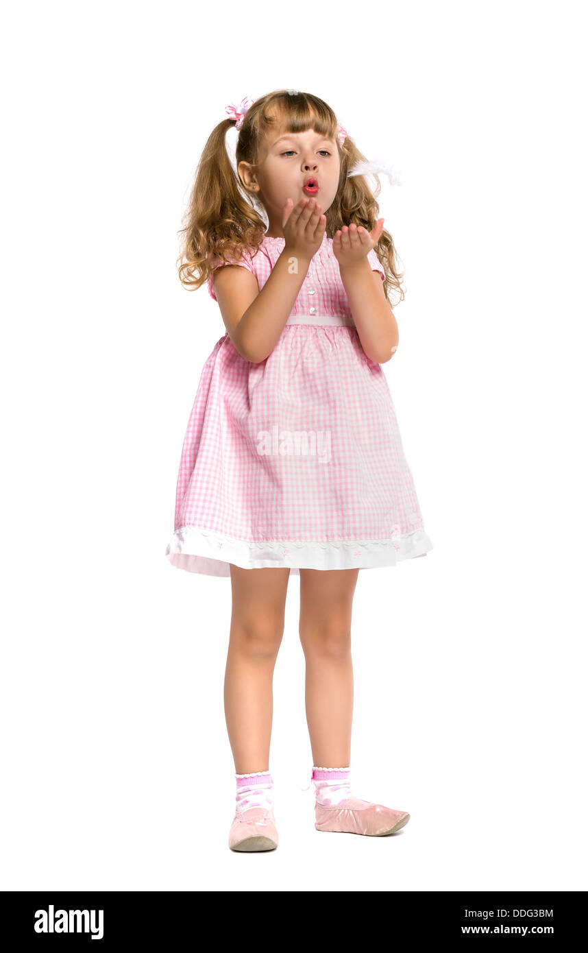 little girl blowing on a feather on a white background, isolated Stock ...