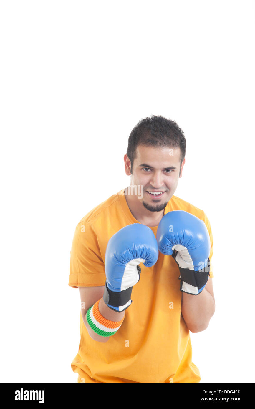 Portrait of an Indian male boxing player isolated over white background ...