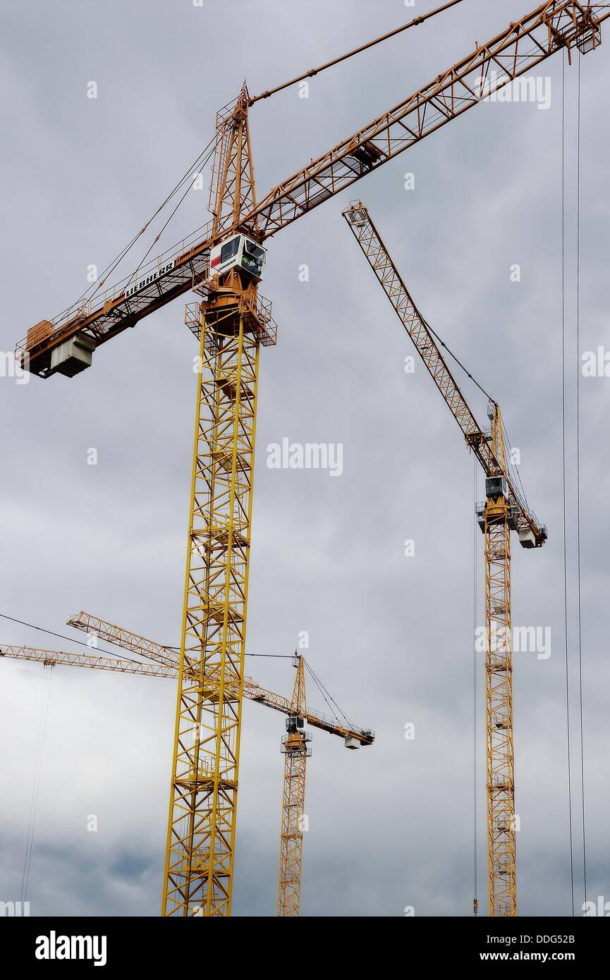 Three construction cranes hi-res stock photography and images - Alamy