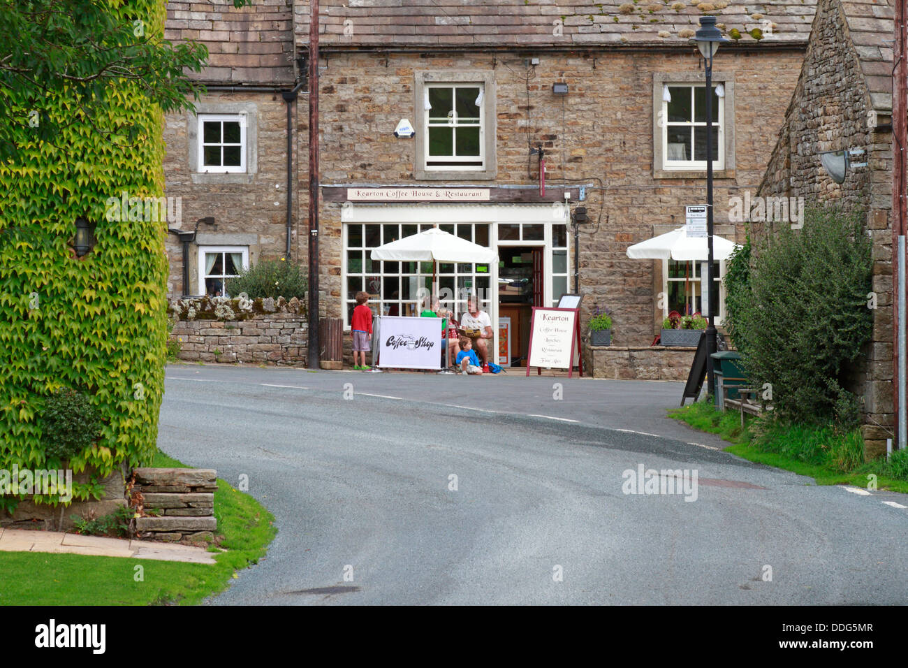 A family sat outside the Kearton Coffee House and Restaurant in Thwaite ...