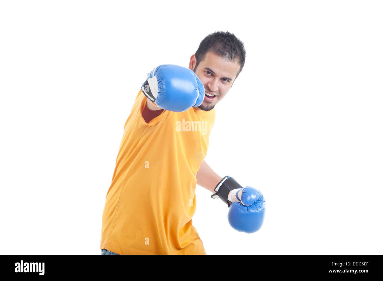 Portrait of young man in fighting stance isolated over white background ...