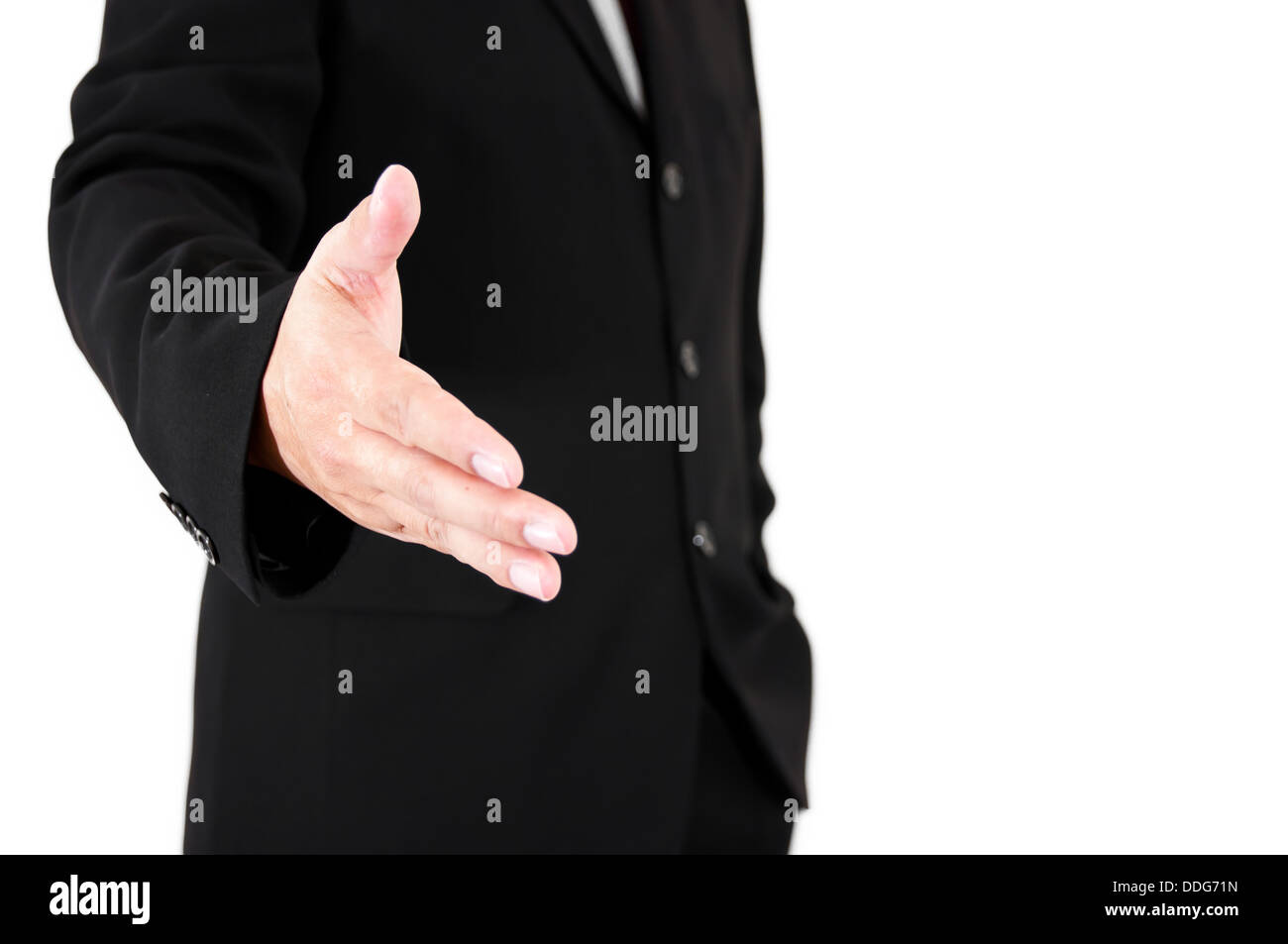 A man in black suite reaching out to shake your hand Stock Photo - Alamy