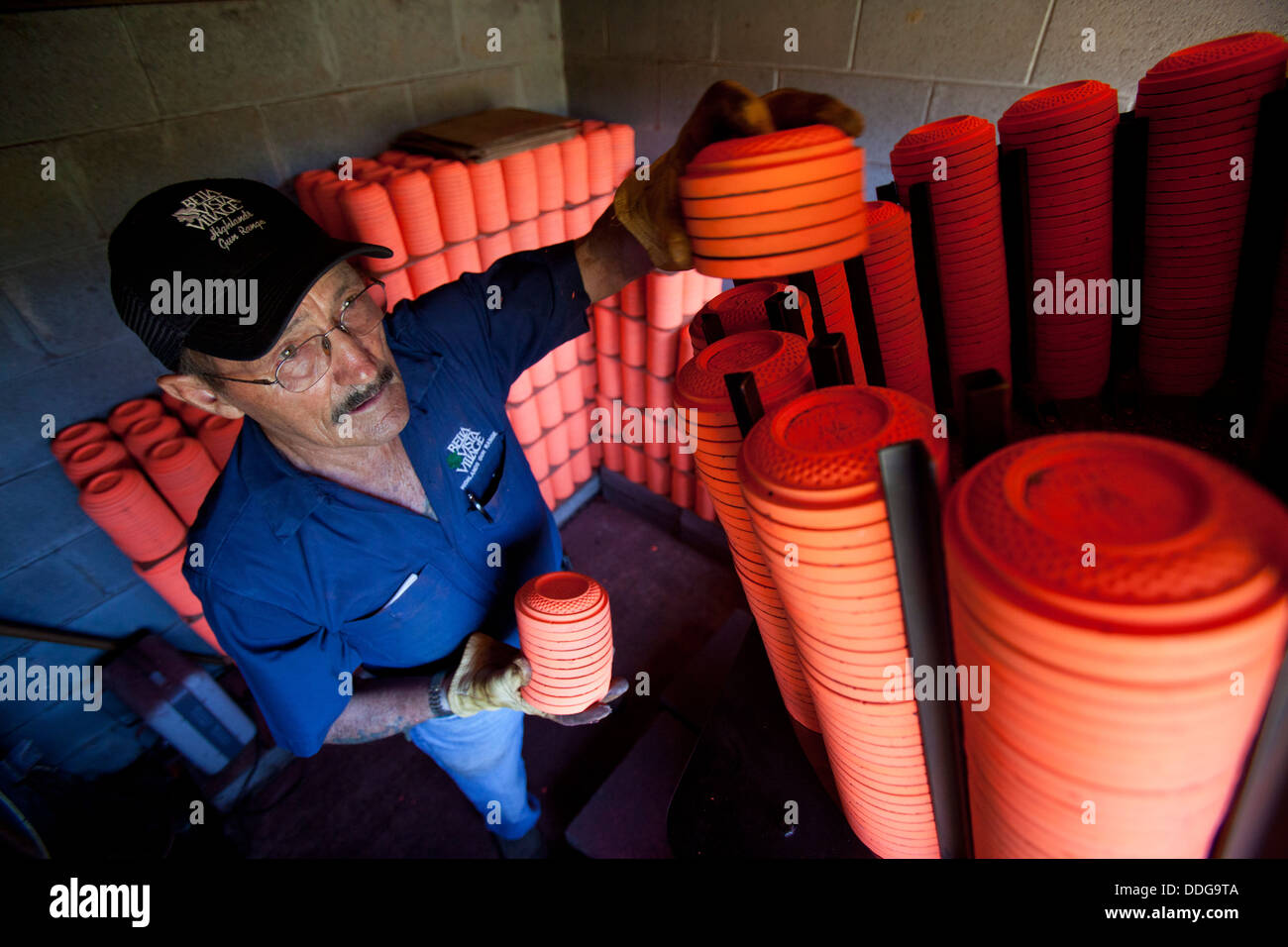 A range master loads clay targets, or clay pigeons, into a launcher at ...