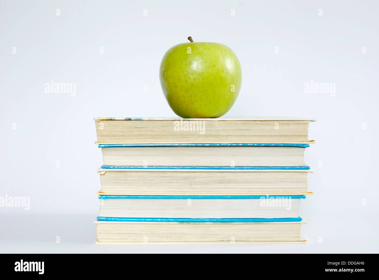 apple and stack books Stock Photo - Alamy