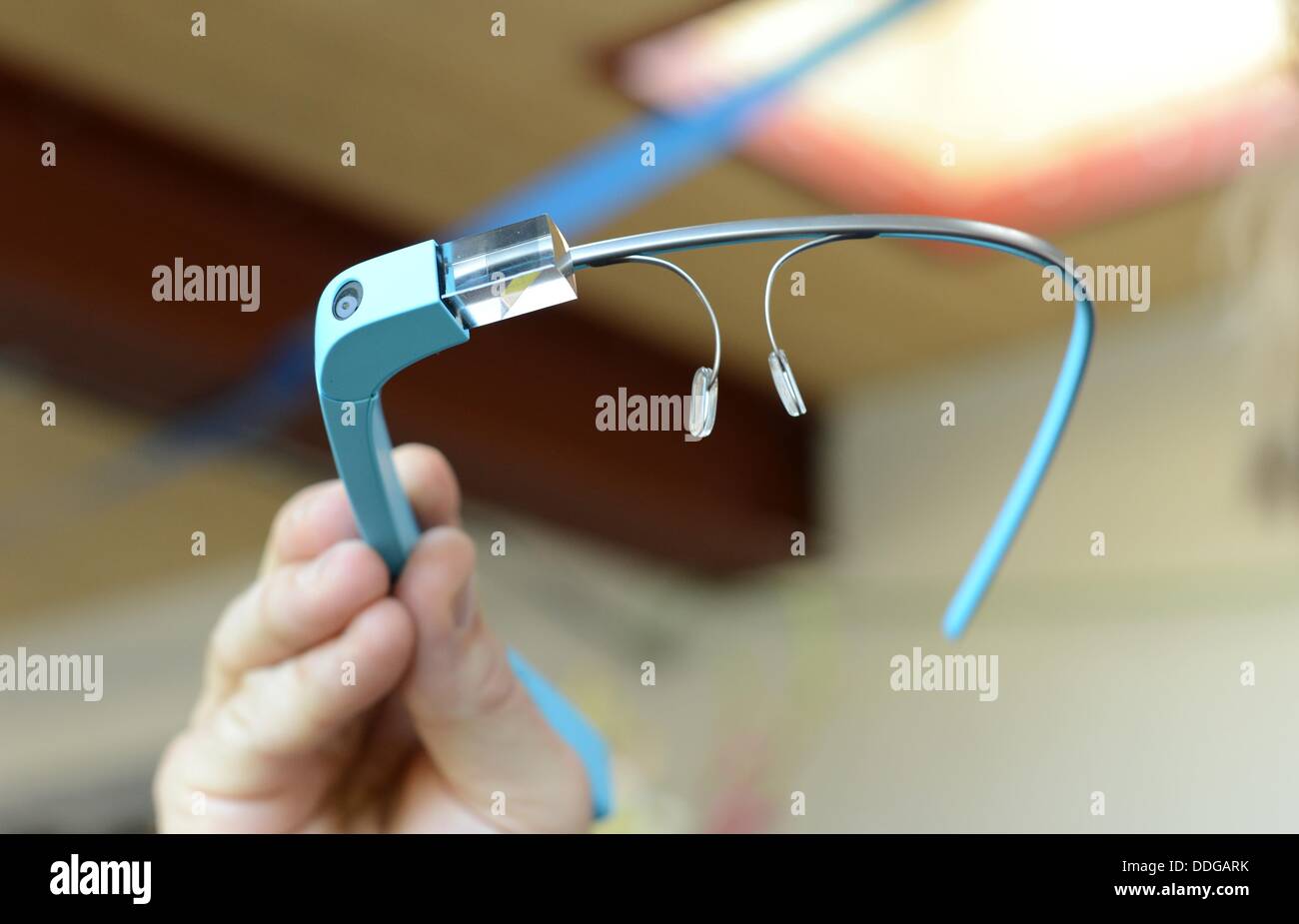A Google Glass, which is a mimiature computer, is attached to a frame ...