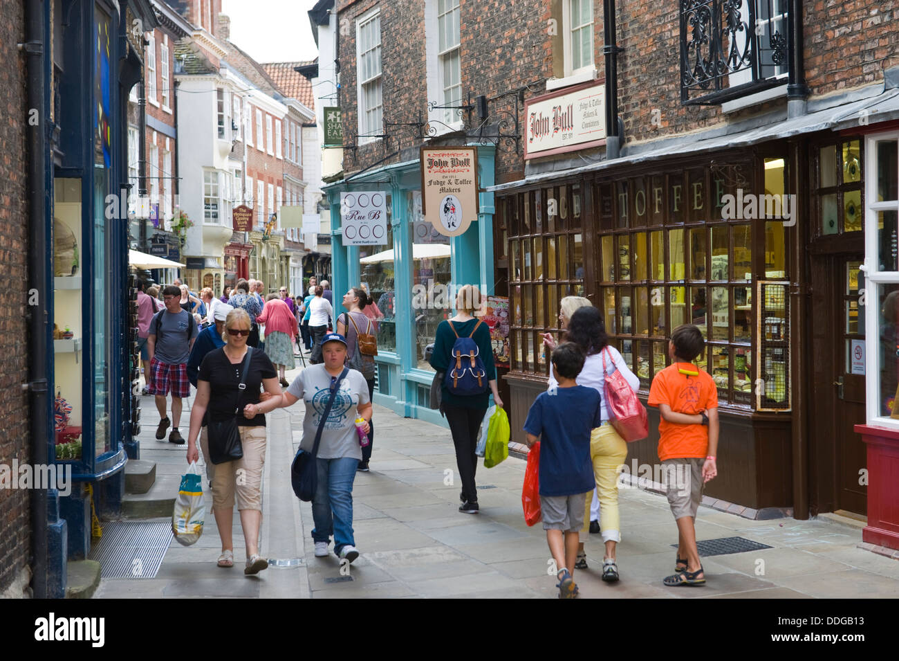 Shoppers and tourists on high street in the city centre of York North ...