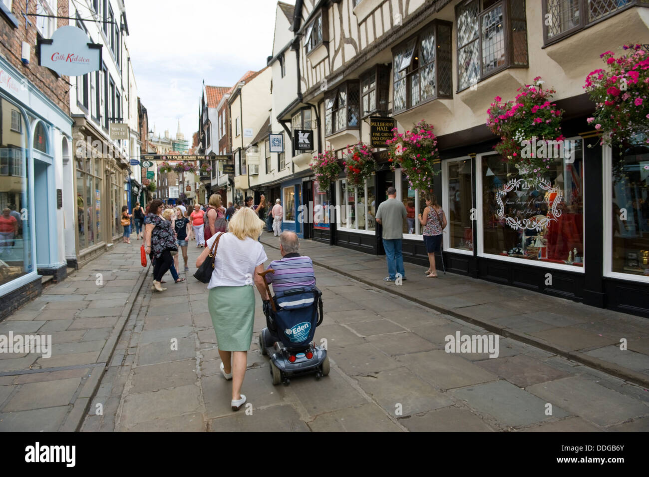 Shoppers and tourists on high street in the city centre of York North ...