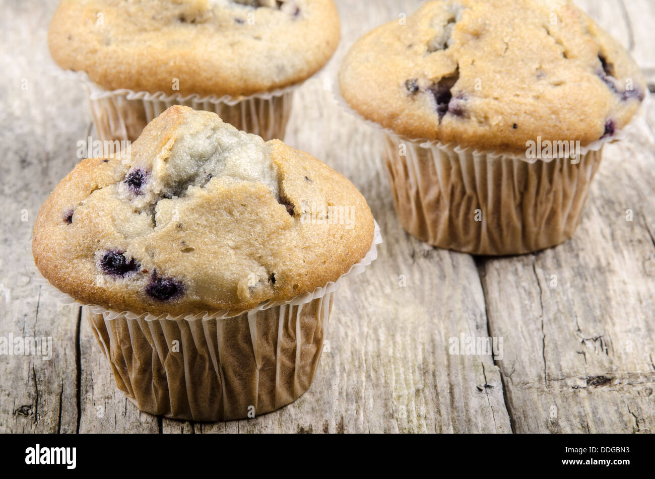 home made cup cake on a timber board Stock Photo - Alamy