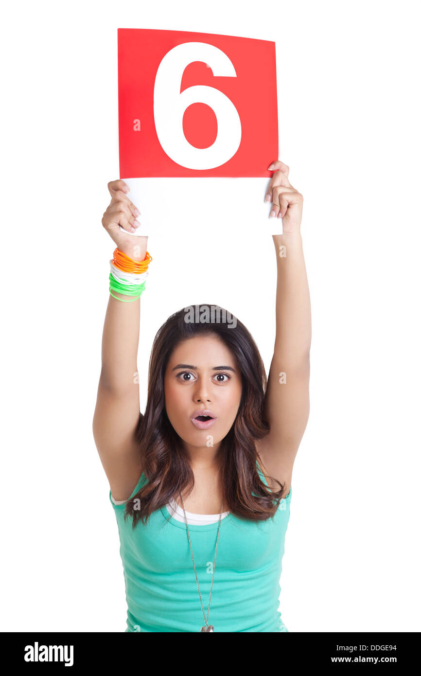 Portrait of young woman signaling a six over white background Stock ...