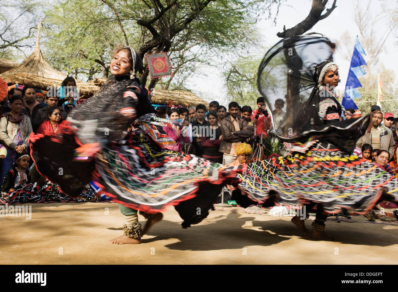 Women in traditional Rajasthani dress performing kalbelia dance in Surajkund Mela, Faridabad ...