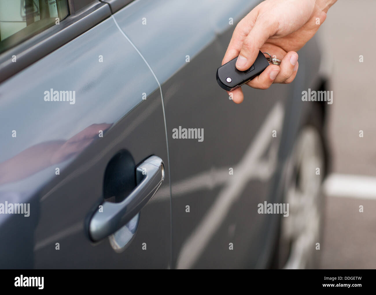 man with car key outside Stock Photo - Alamy