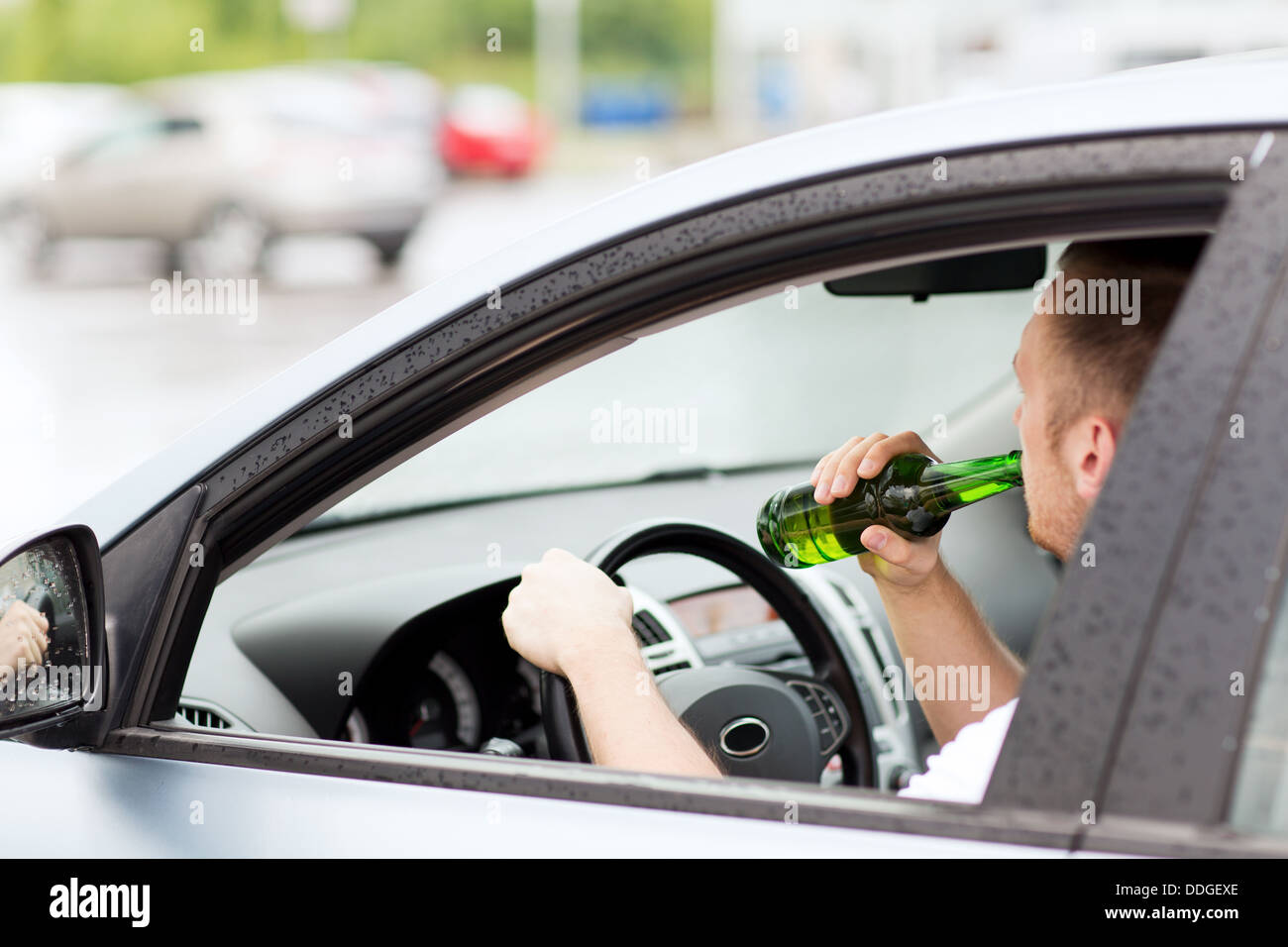 man drinking alcohol while driving the car Stock Photo - Alamy