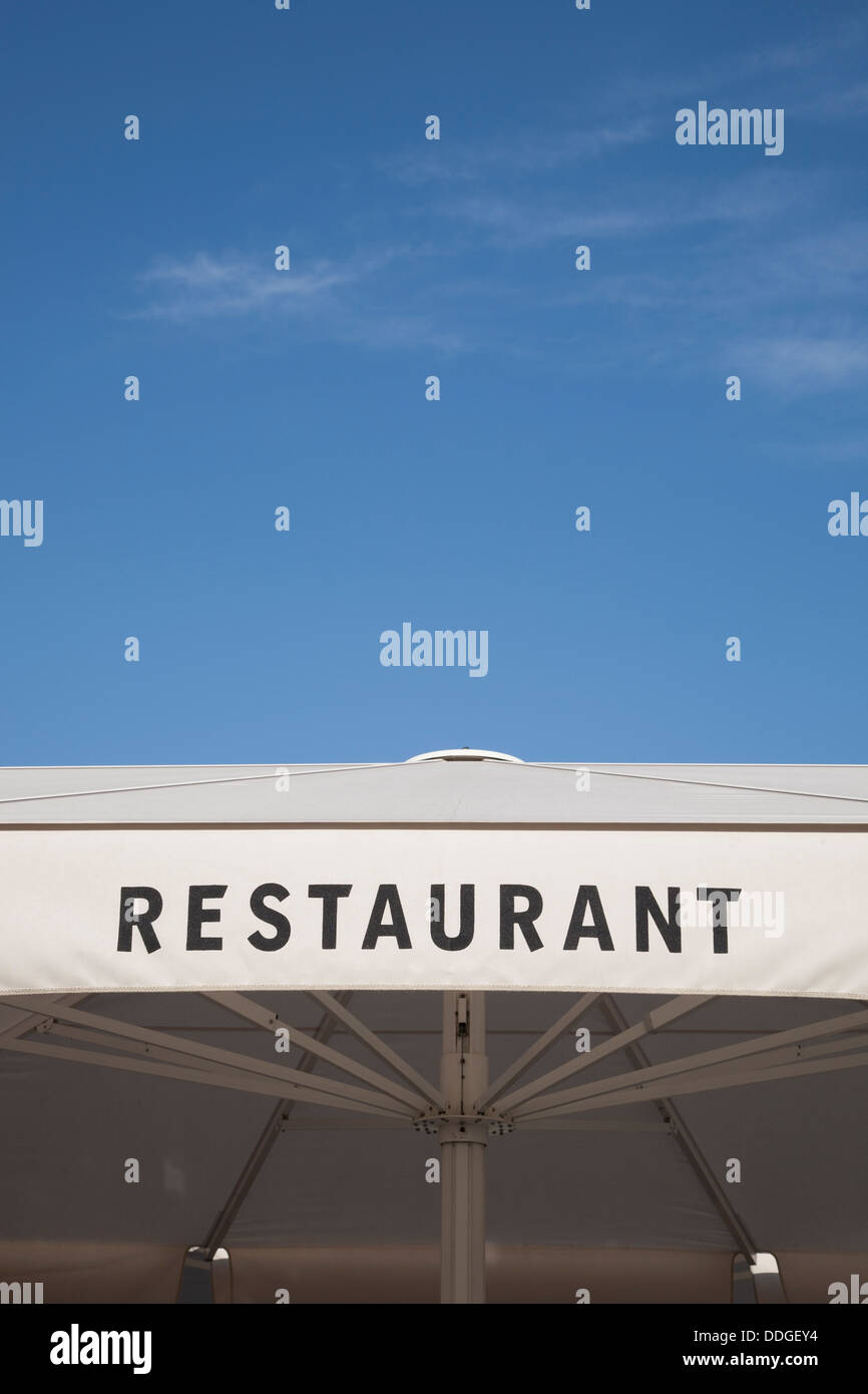 Restaurant Sign against Blue Sky Stock Photo - Alamy