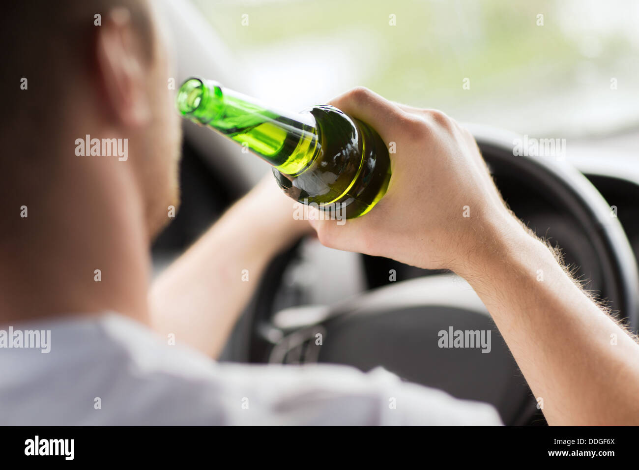 man drinking alcohol while driving the car Stock Photo - Alamy