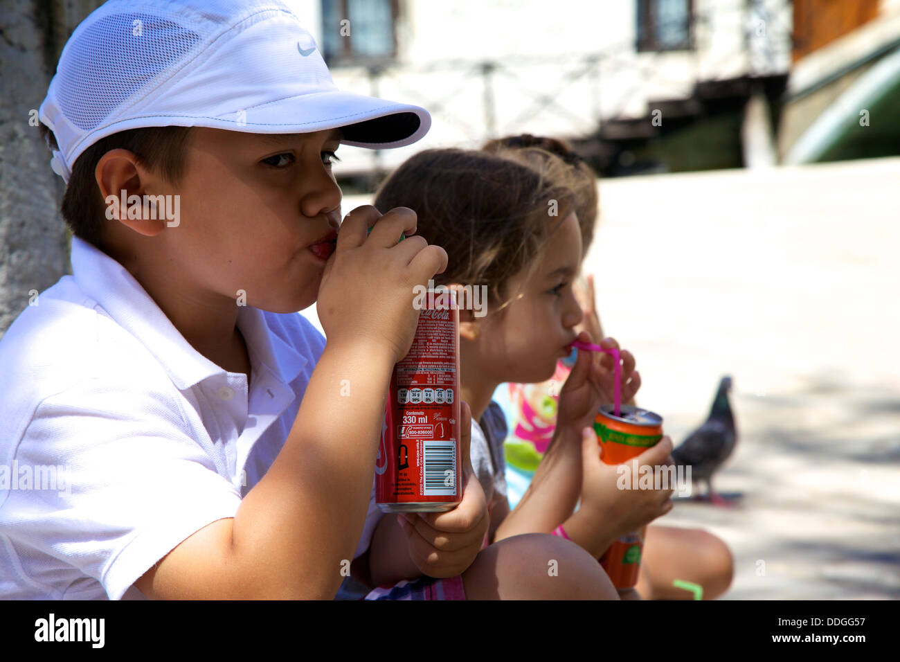 boys drinking soda outdoors at San Marco square, venice italy Stock ...