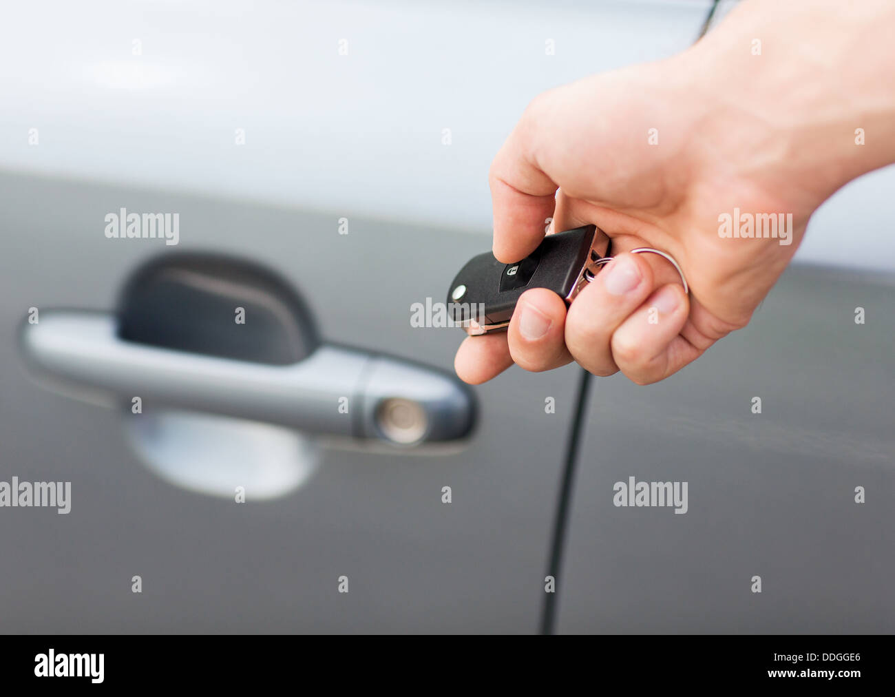 man with car key outside Stock Photo - Alamy