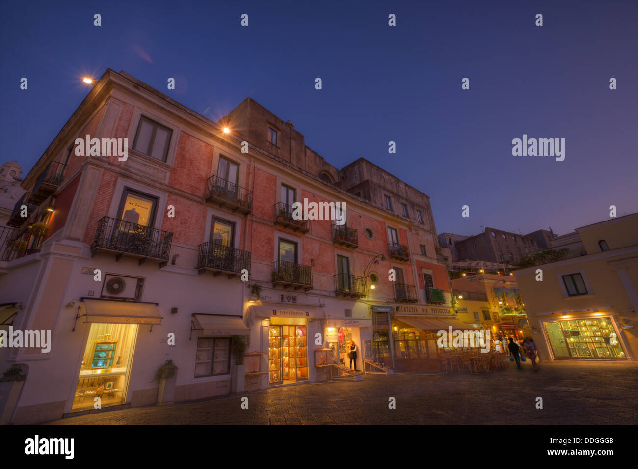 Buildings lit up at night at a town square, Piazza Del Funicolare ...