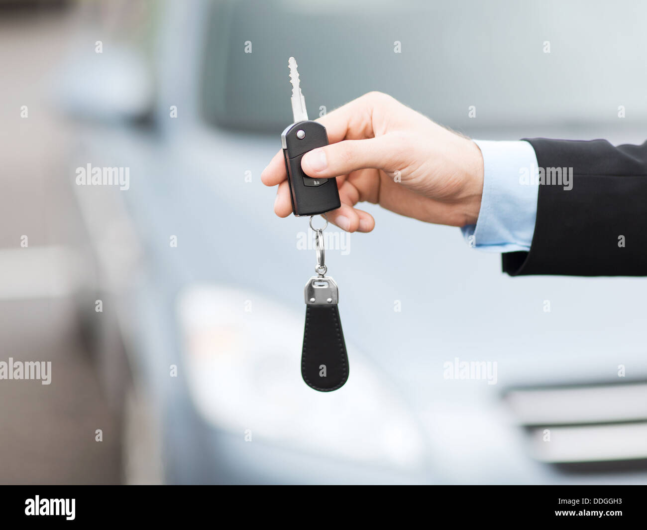 man with car key outside Stock Photo - Alamy