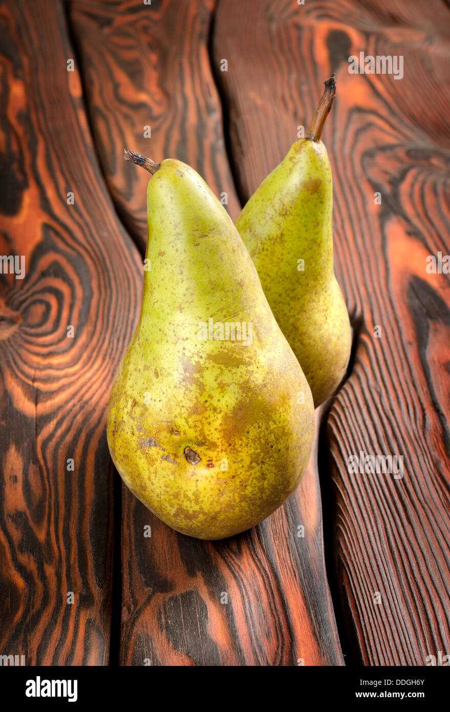 Two pears on an old wooden background Stock Photo - Alamy
