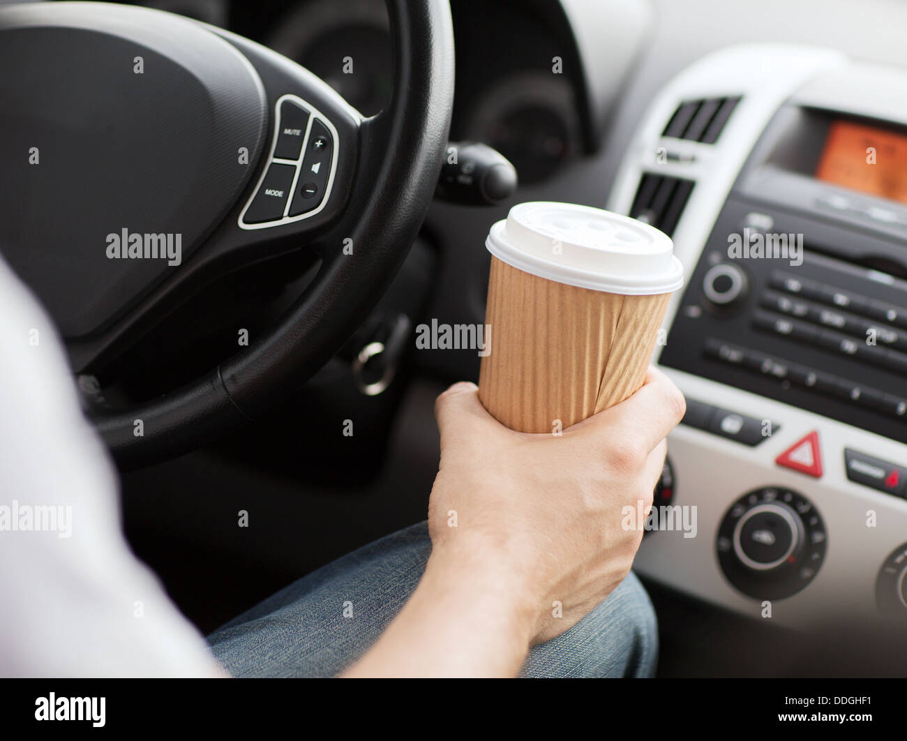 man drinking coffee while driving the car Stock Photo - Alamy