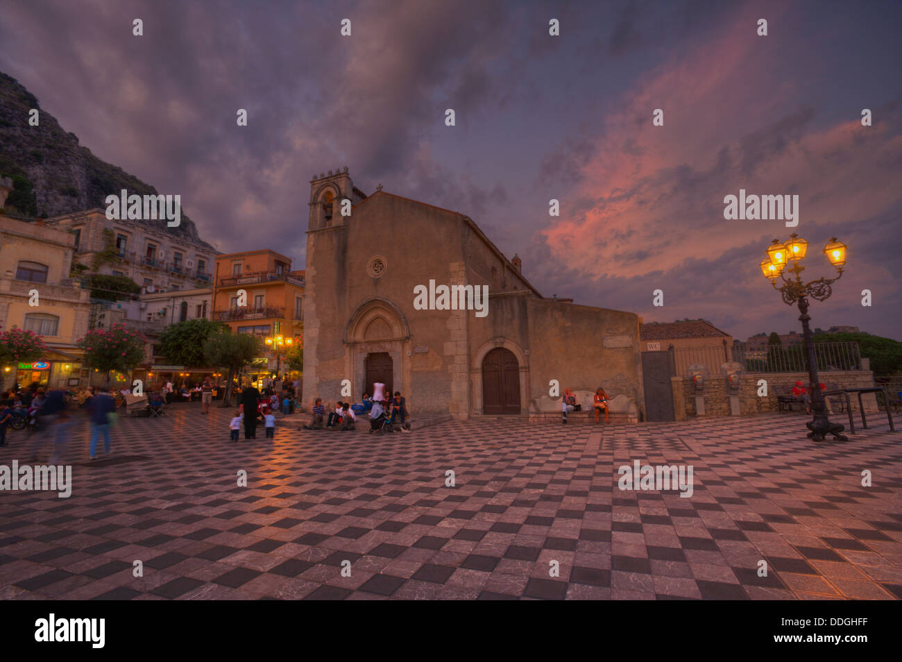 Tourists outside a church, San Giuseppe Church, Taormina, Sicily, Italy ...