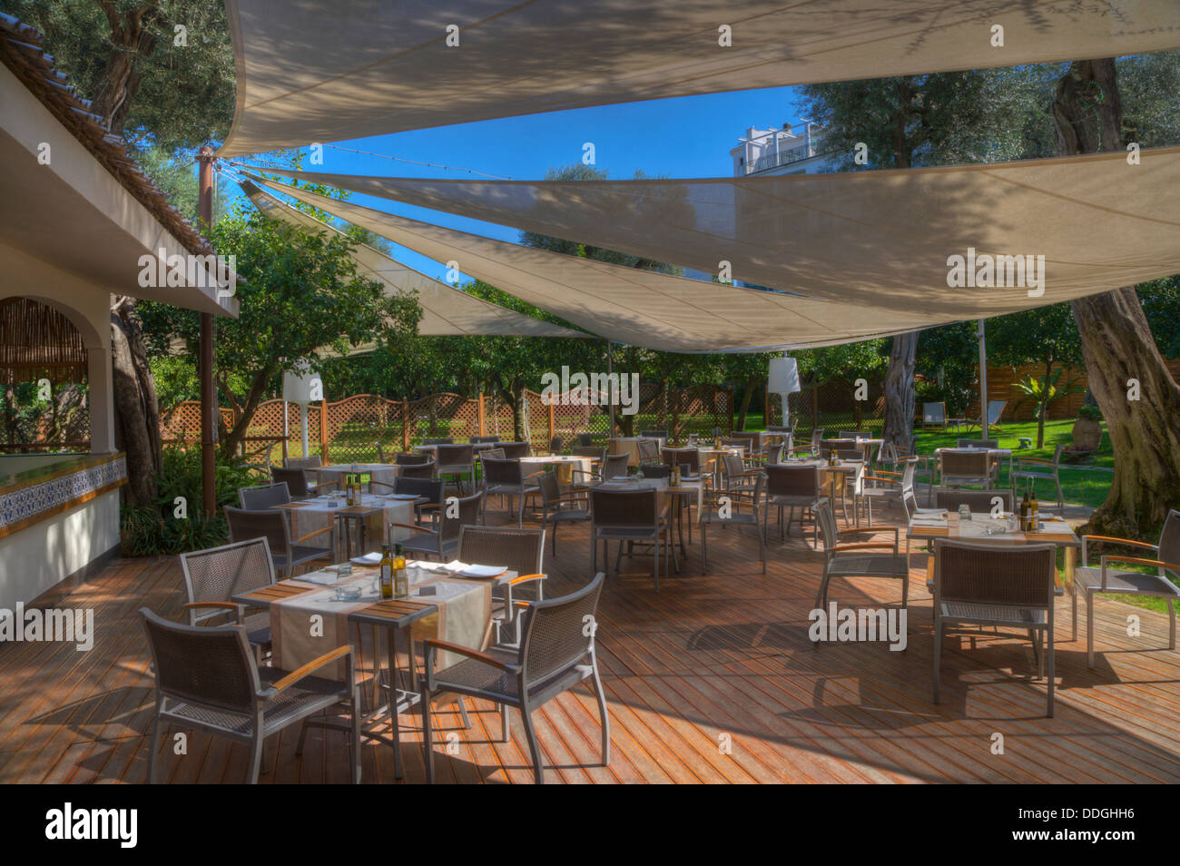 Empty tables and chairs at the restaurant of a hotel, Sorrento ...