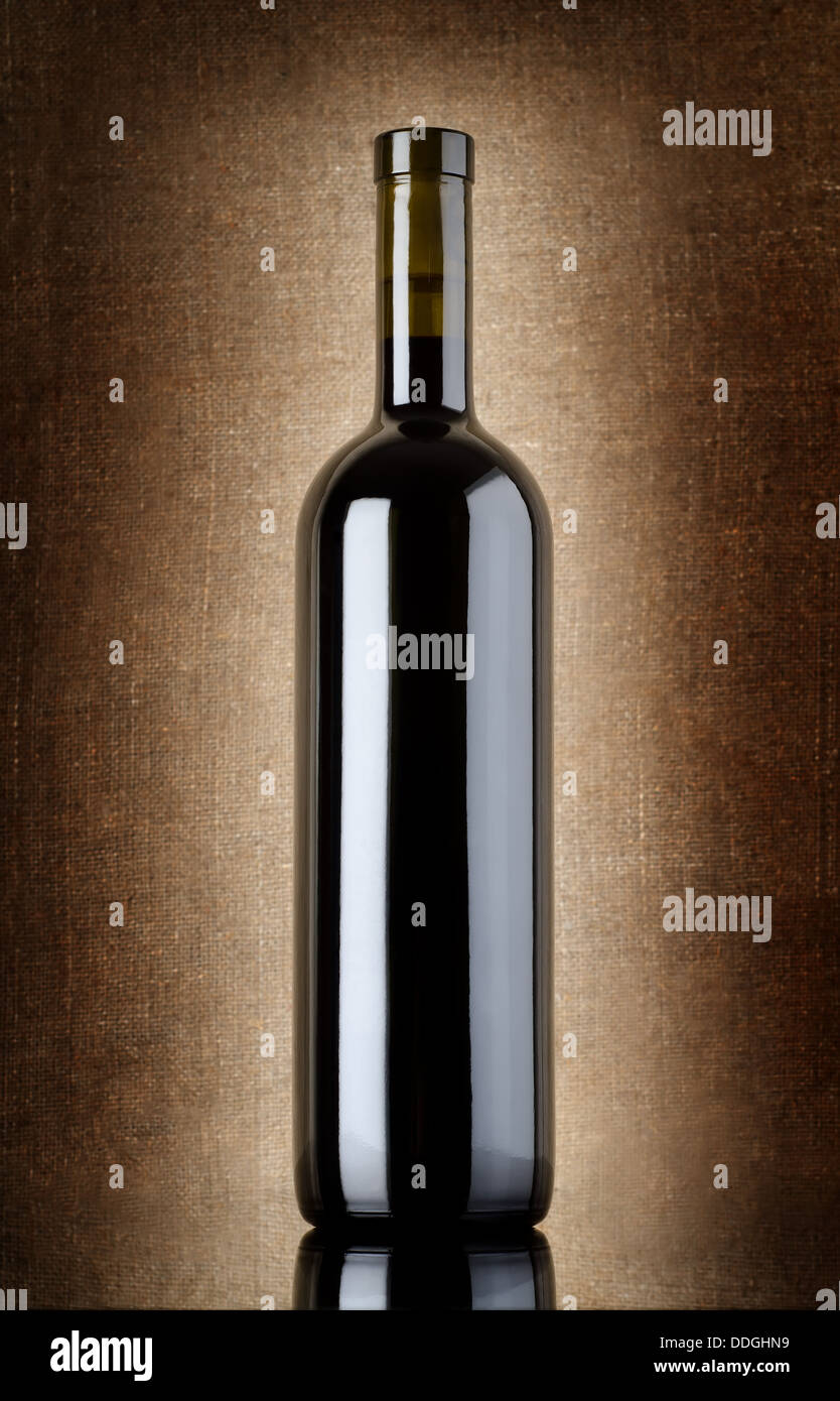 Wine bottle on a old canvas Stock Photo - Alamy