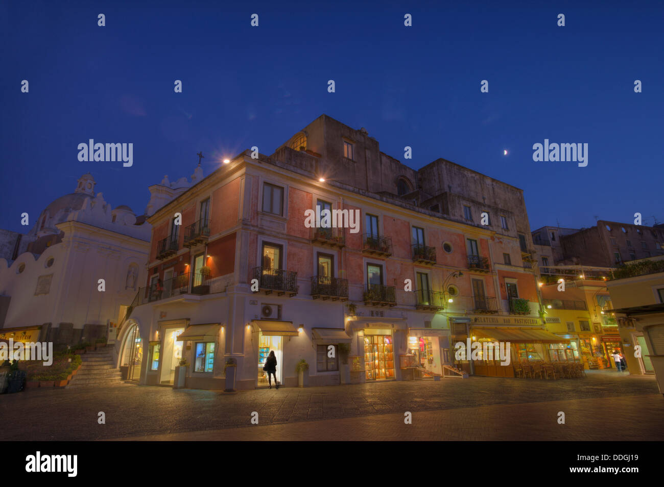 Buildings lit up at night at a town square, Piazza Del Funicolare ...