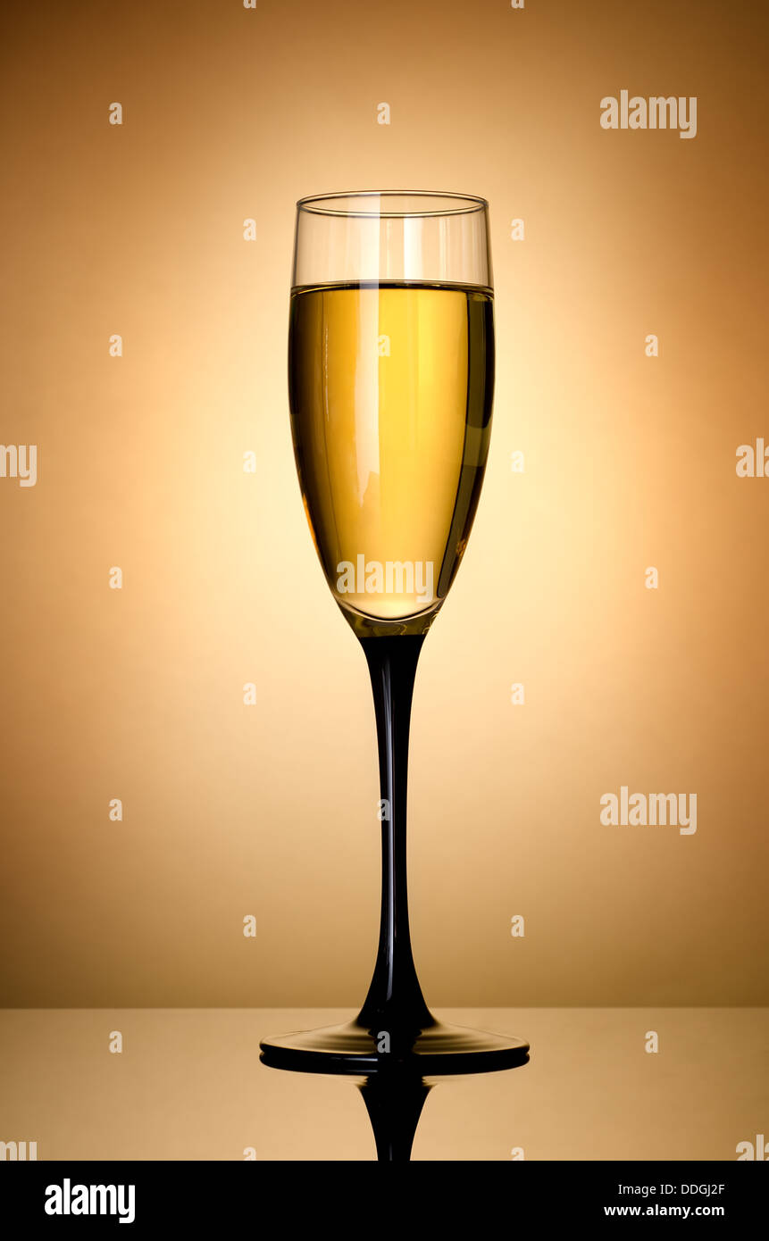 Wineglass over gold background Stock Photo - Alamy