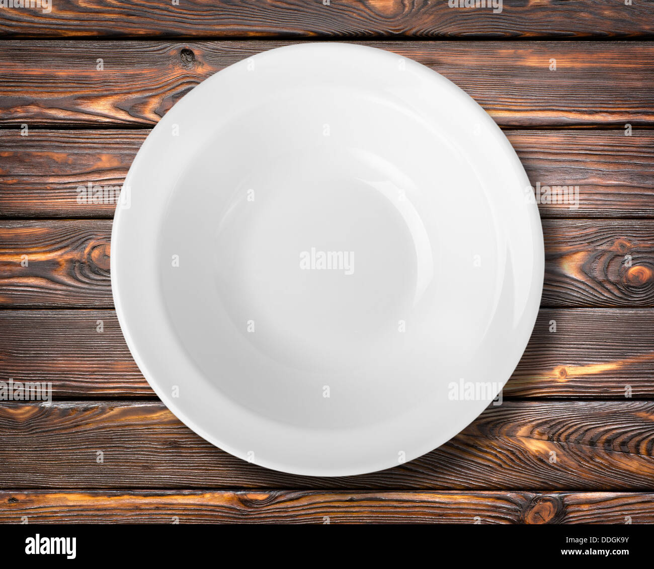 White plate on a table Stock Photo - Alamy
