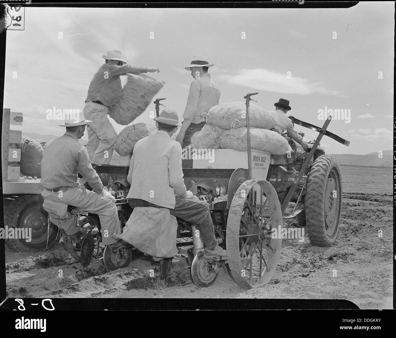 Seed loading Black and White Stock Photos & Images - Alamy