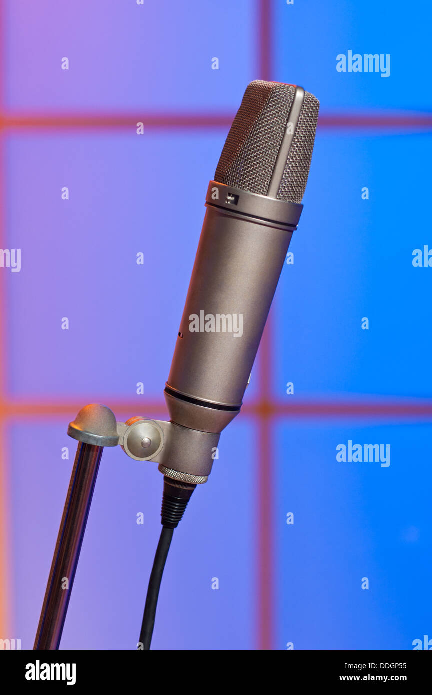 microphone on stage with blue background Stock Photo - Alamy