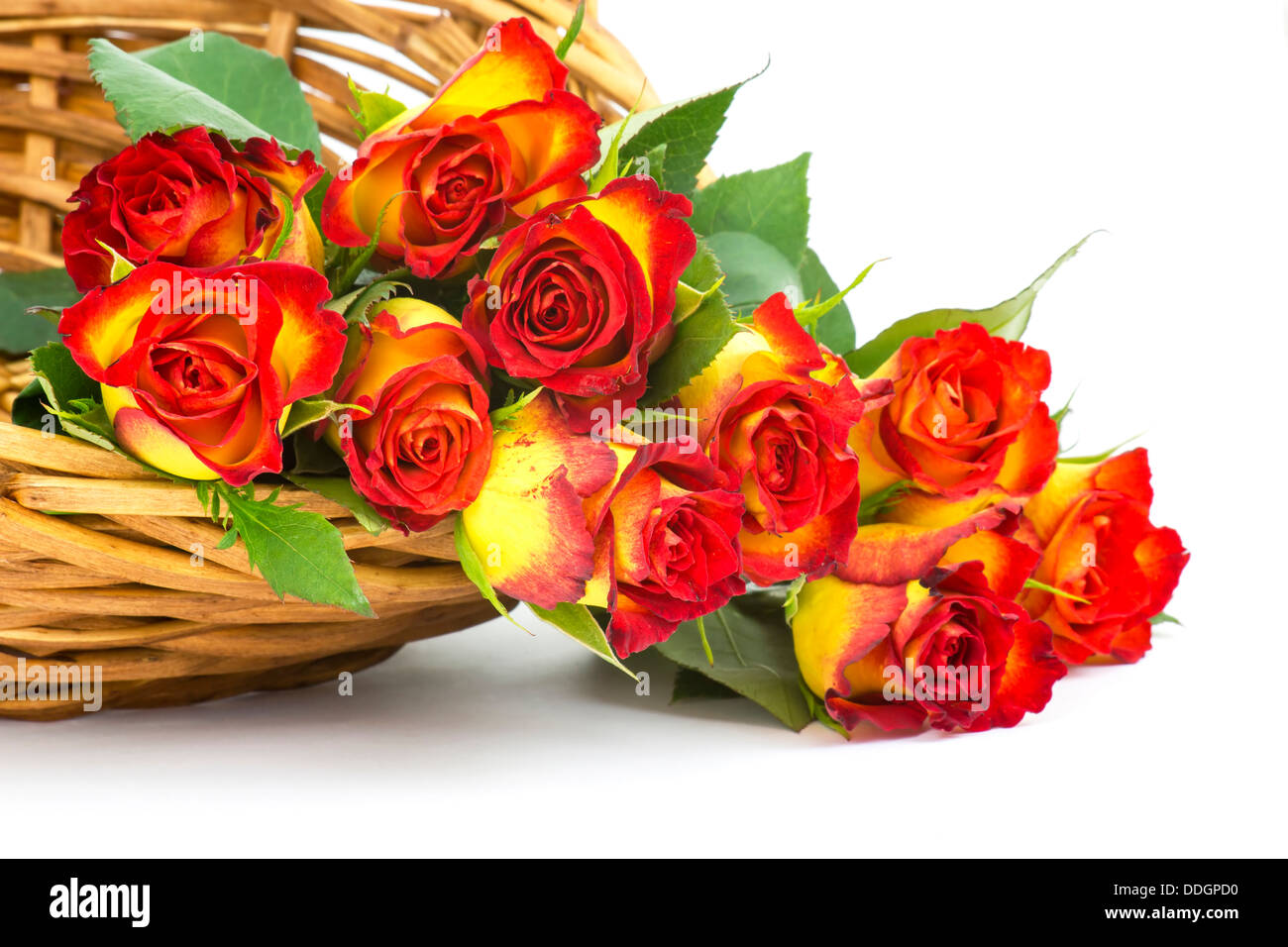 red and yellow roses in a basket Stock Photo - Alamy