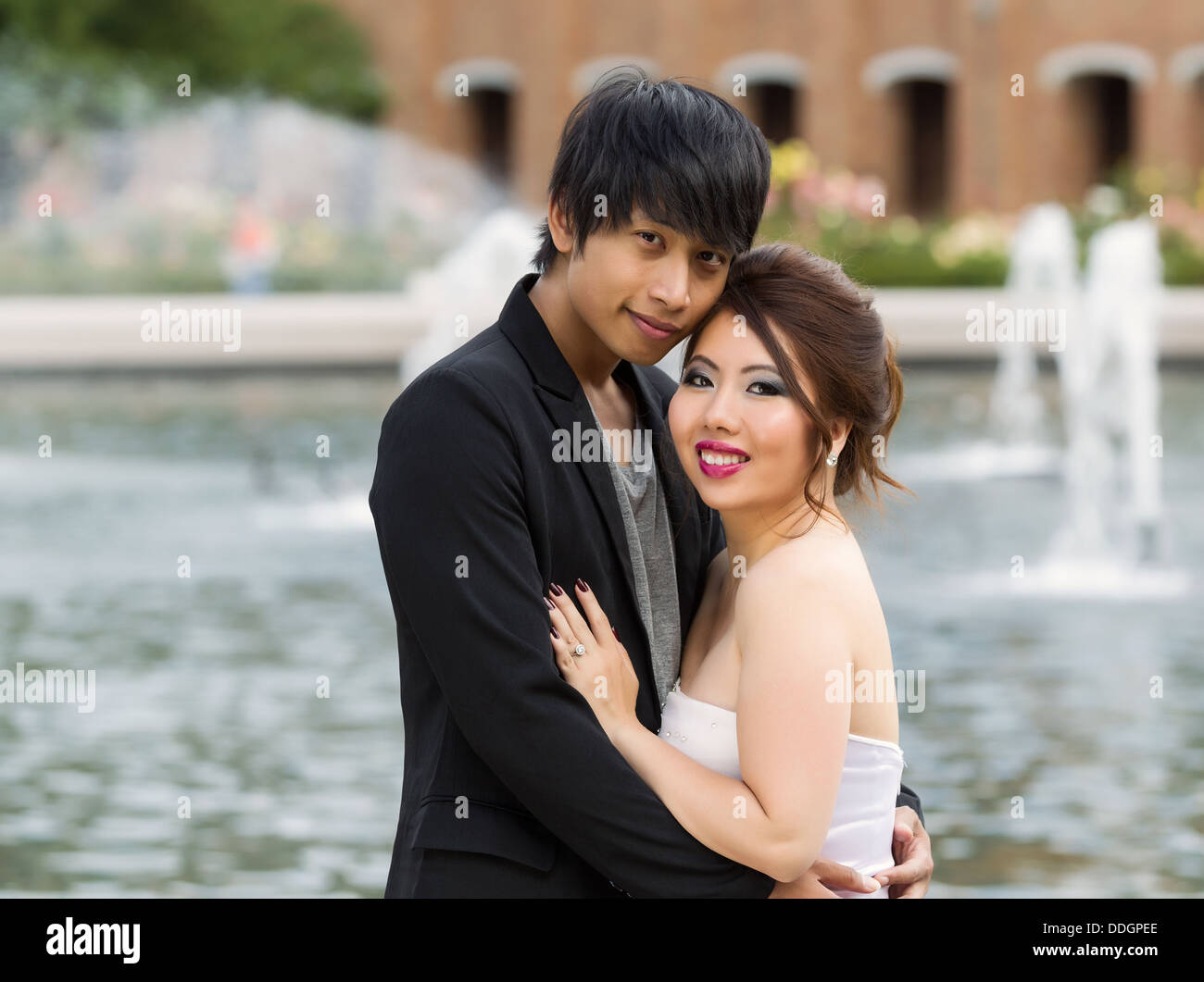 Closeup horizontal photo of young adult couple, looking forward, while ...