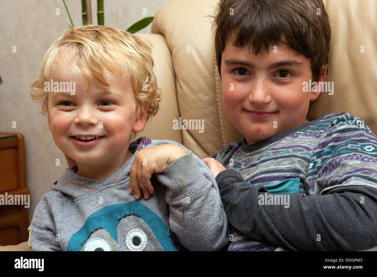 Family photos 2 boys toddler cousins holding smiling tickling Stock ...