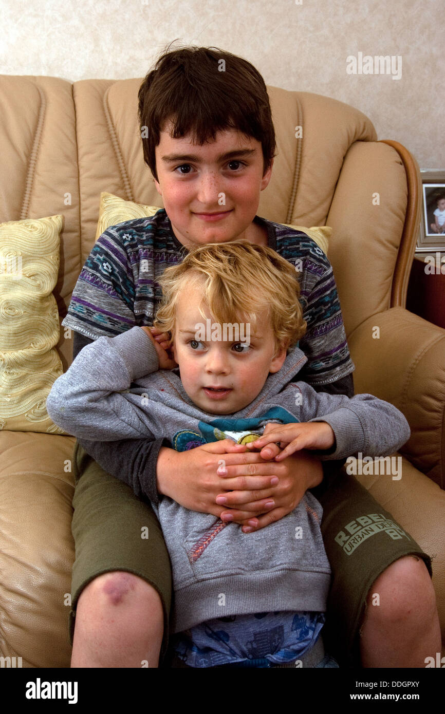 Family photos 2 boys toddler cousins holding smiling Stock Photo - Alamy