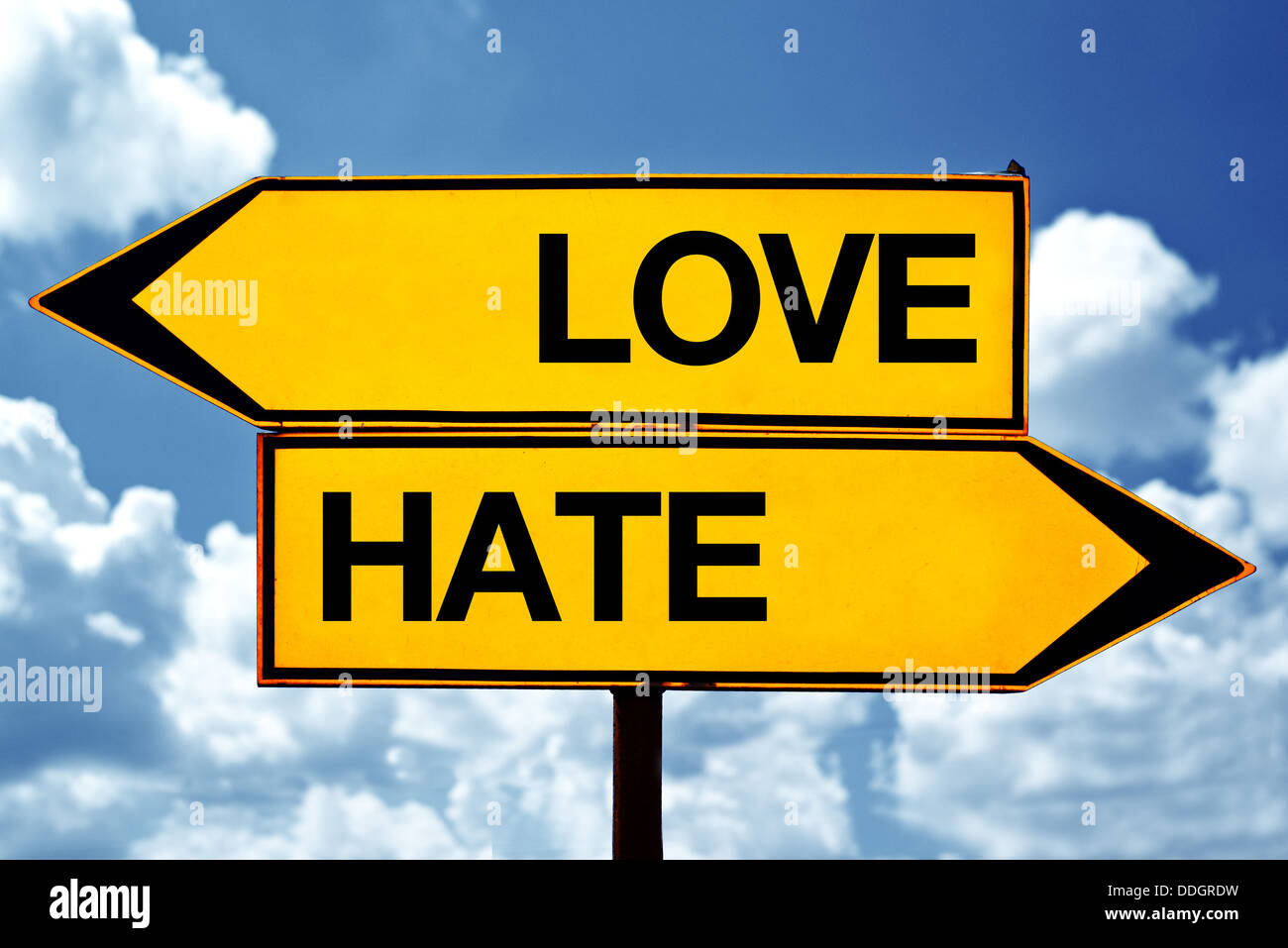 Love or hate, opposite signs. Two blank opposite signs against blue sky ...