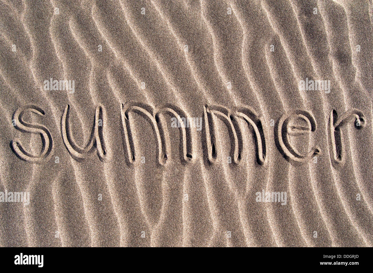 the word summer written in sand Stock Photo - Alamy