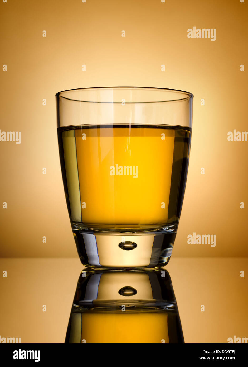 Whisky on a gold background Stock Photo - Alamy