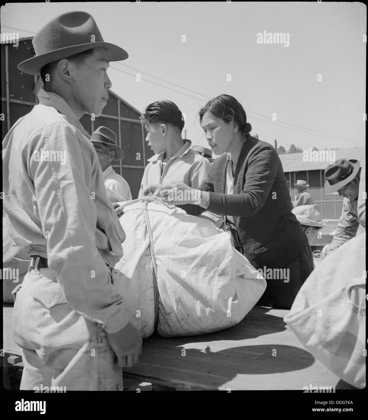 Families arriving at the Turlock Assembly Center during WWII undergo ...