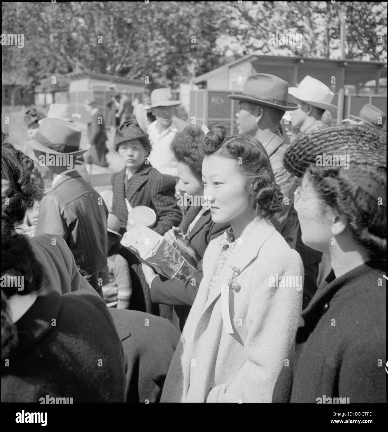 This photograph depicts families of Japanese ancestry arriving at the ...