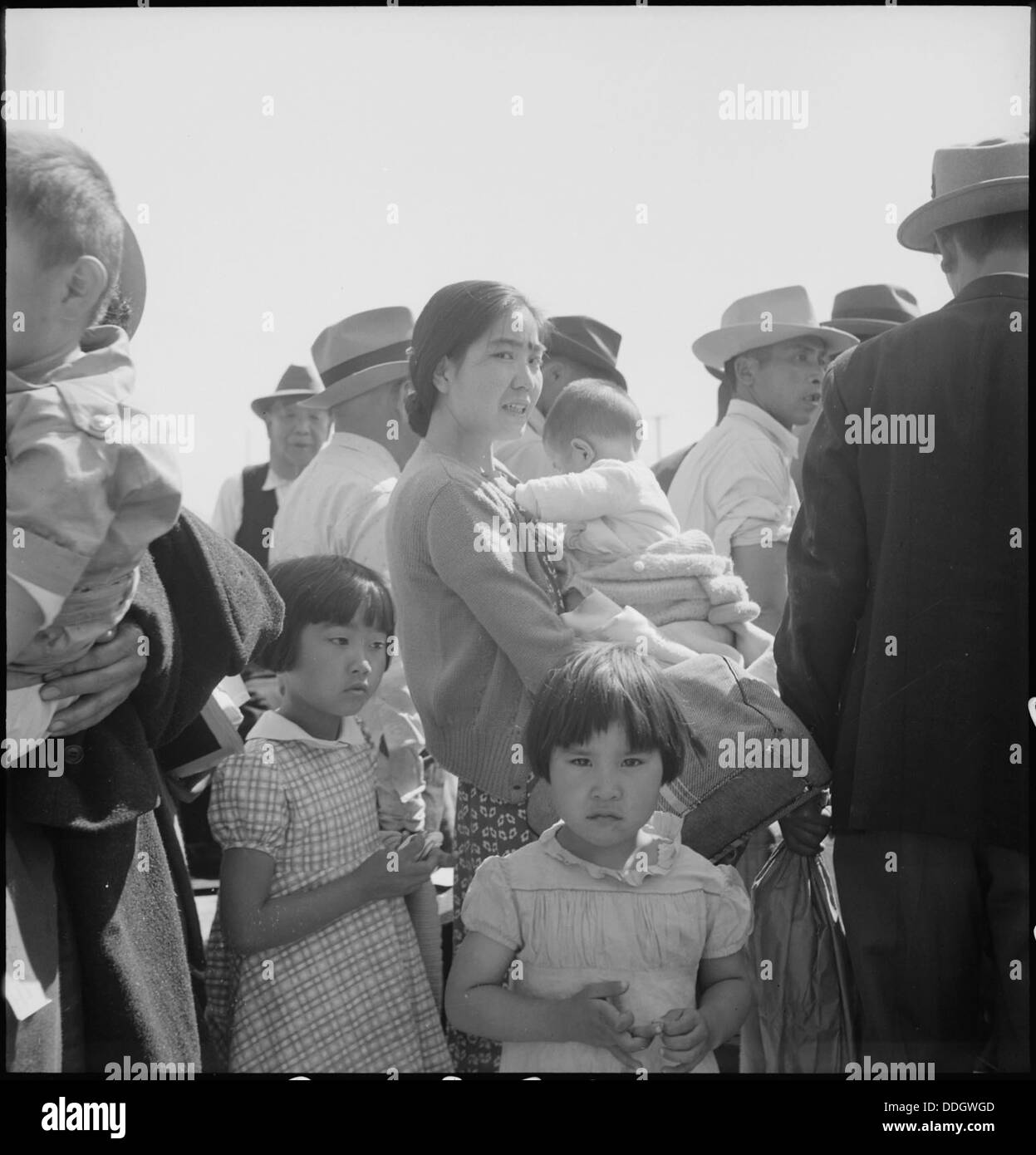 This photograph captures families of Japanese ancestry arriving at the ...