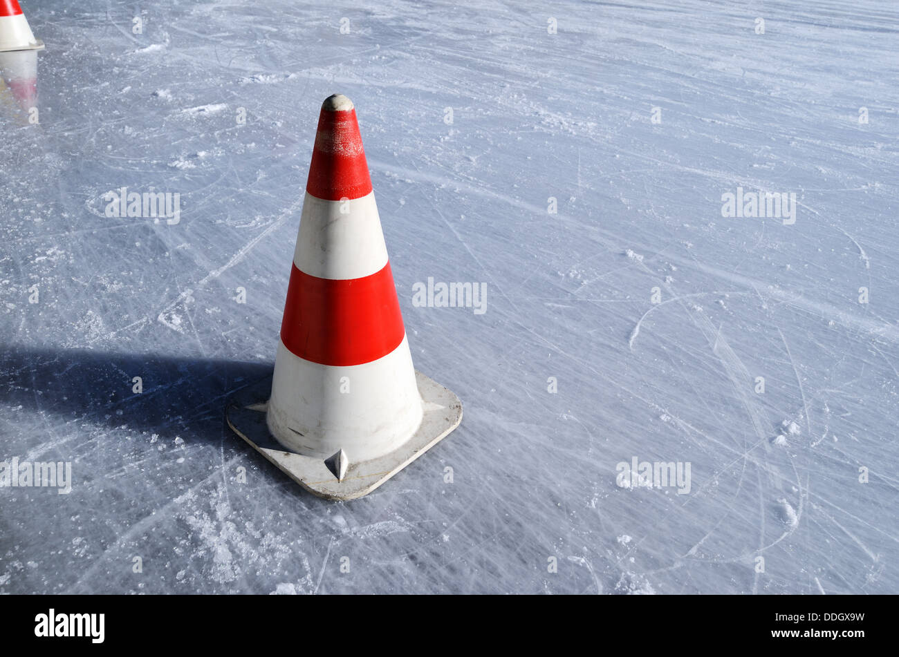 red white striped cones on the ice rink, horizontal Stock Photo - Alamy