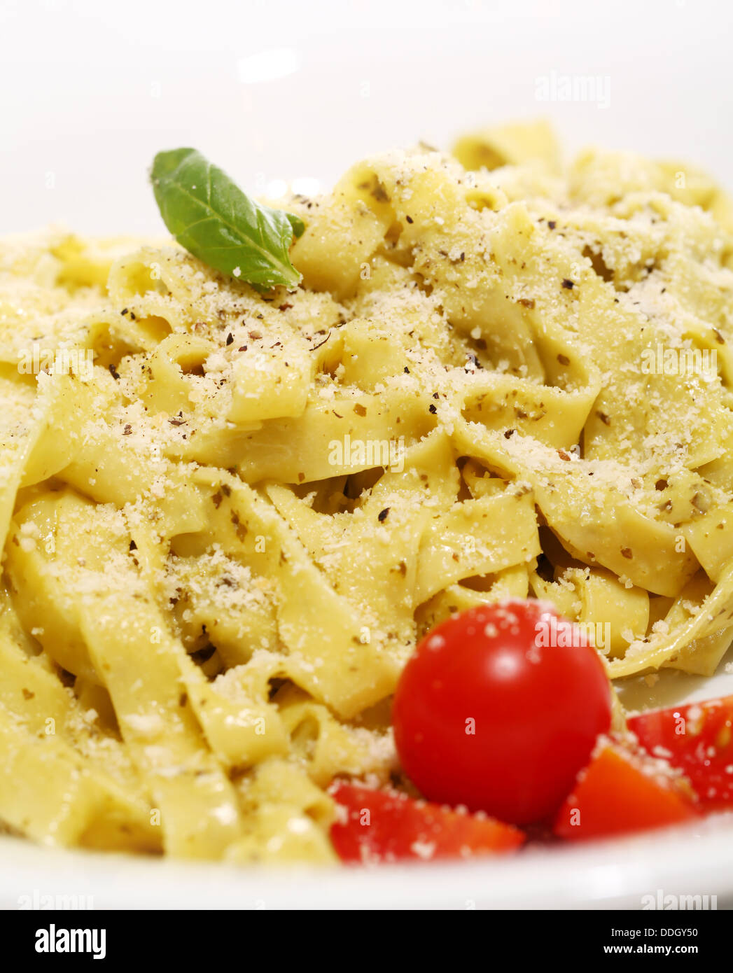 Italian pasta with basil and tomatoes Stock Photo - Alamy