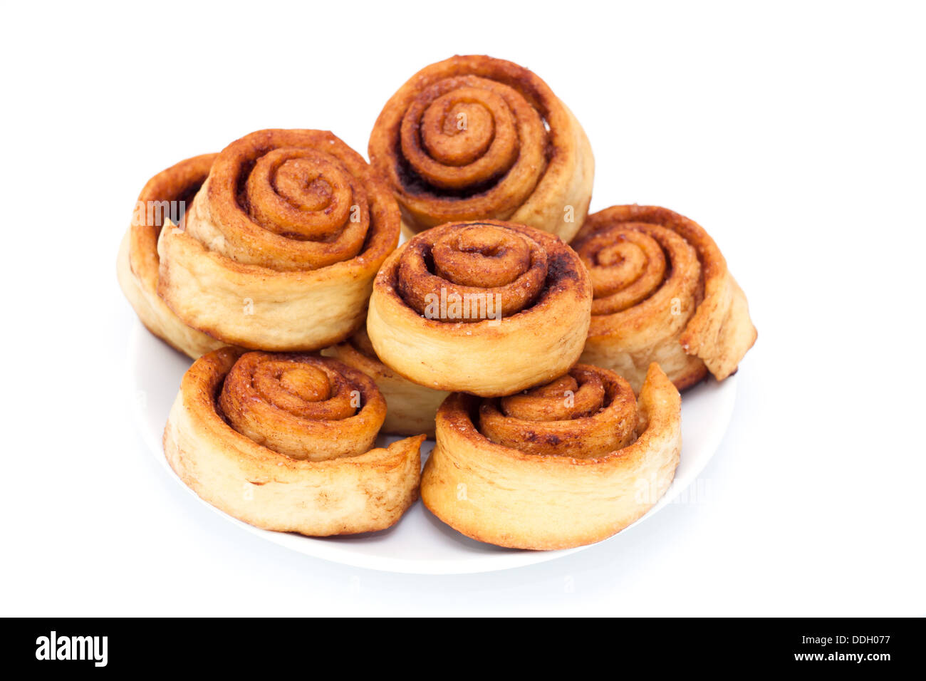 Cinnamon rolls group on the plate, white background Stock Photo - Alamy